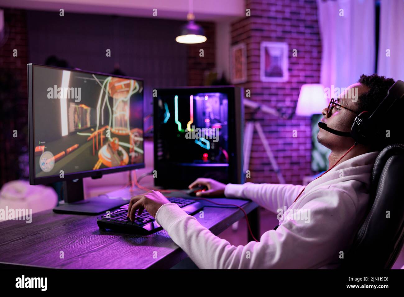 Internet vlogger broadcasting live video games play on computer, having ...