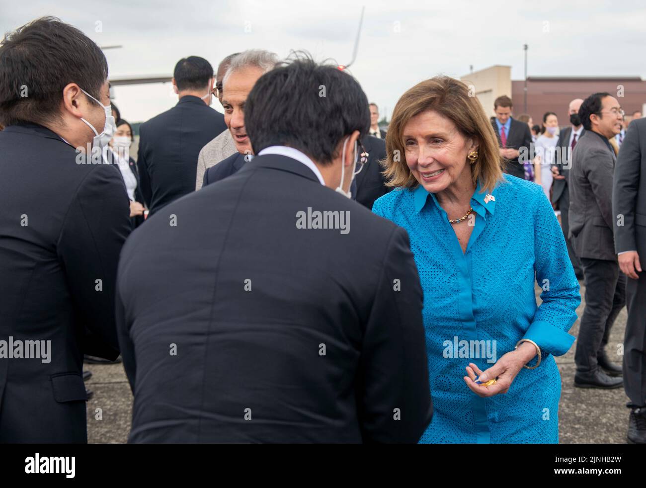 Speaker of the House Nancy Pelosi interacts with a Japanese official ...