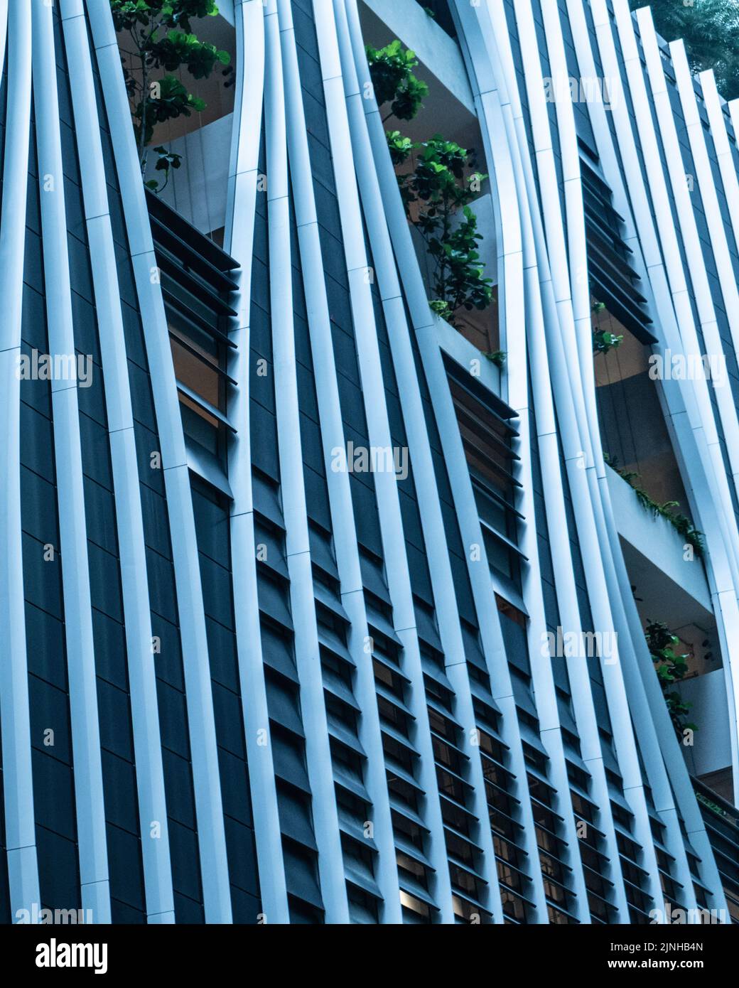 A vertical shot of a modern building facade design Stock Photo - Alamy