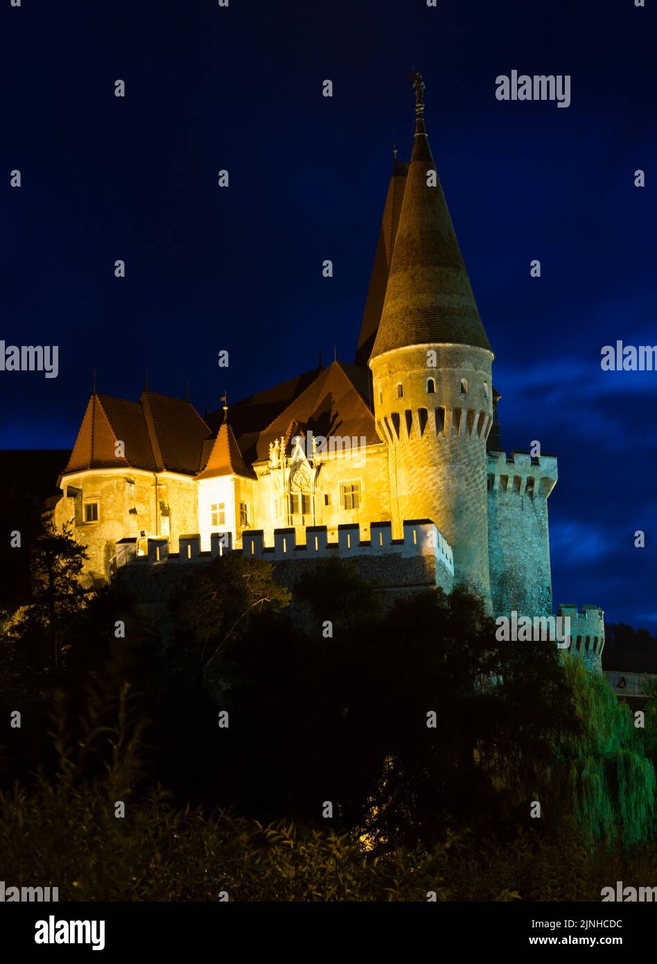 Corvin Castle is on the green mountain in night Stock Photo - Alamy