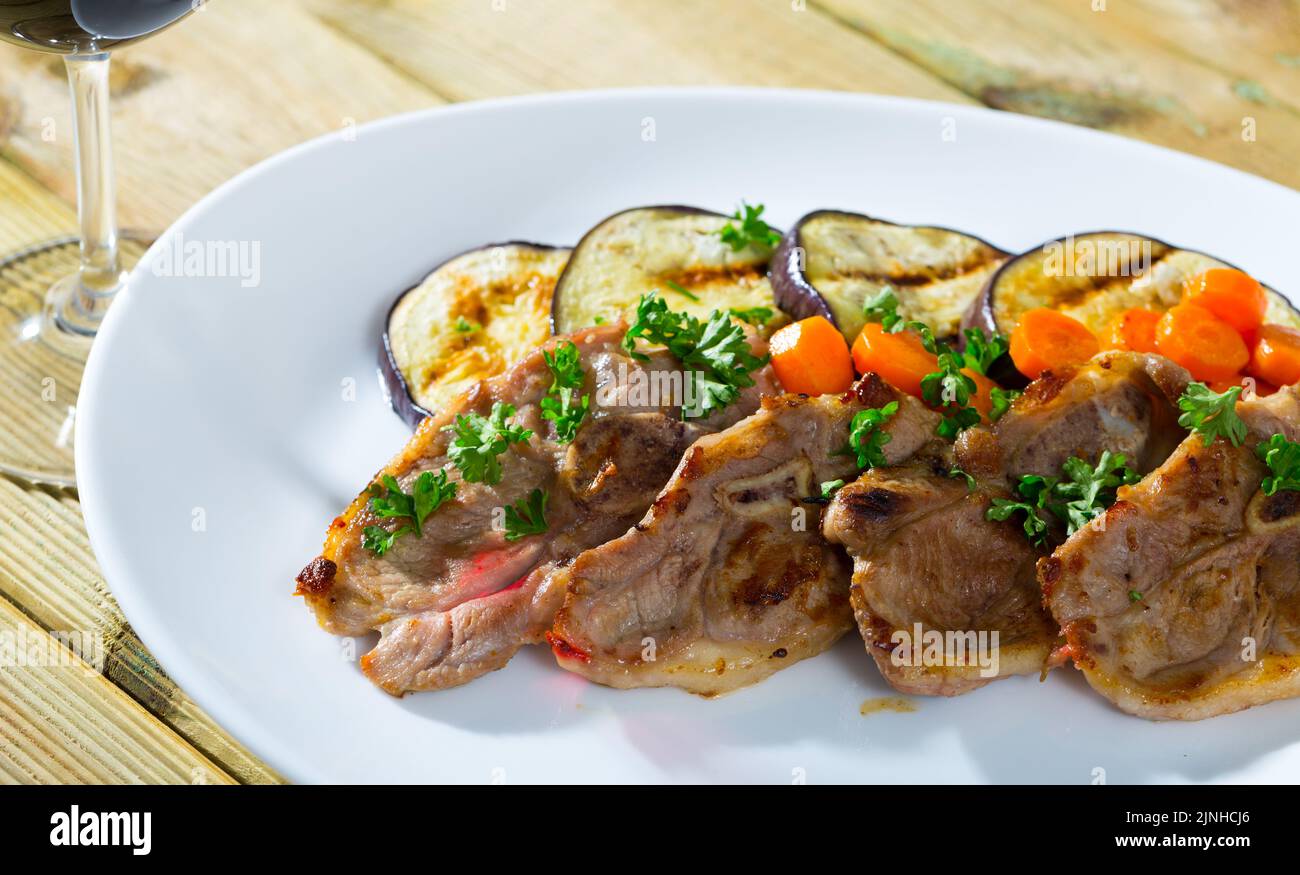 Mutton loin chops grilled with eggplant Stock Photo - Alamy