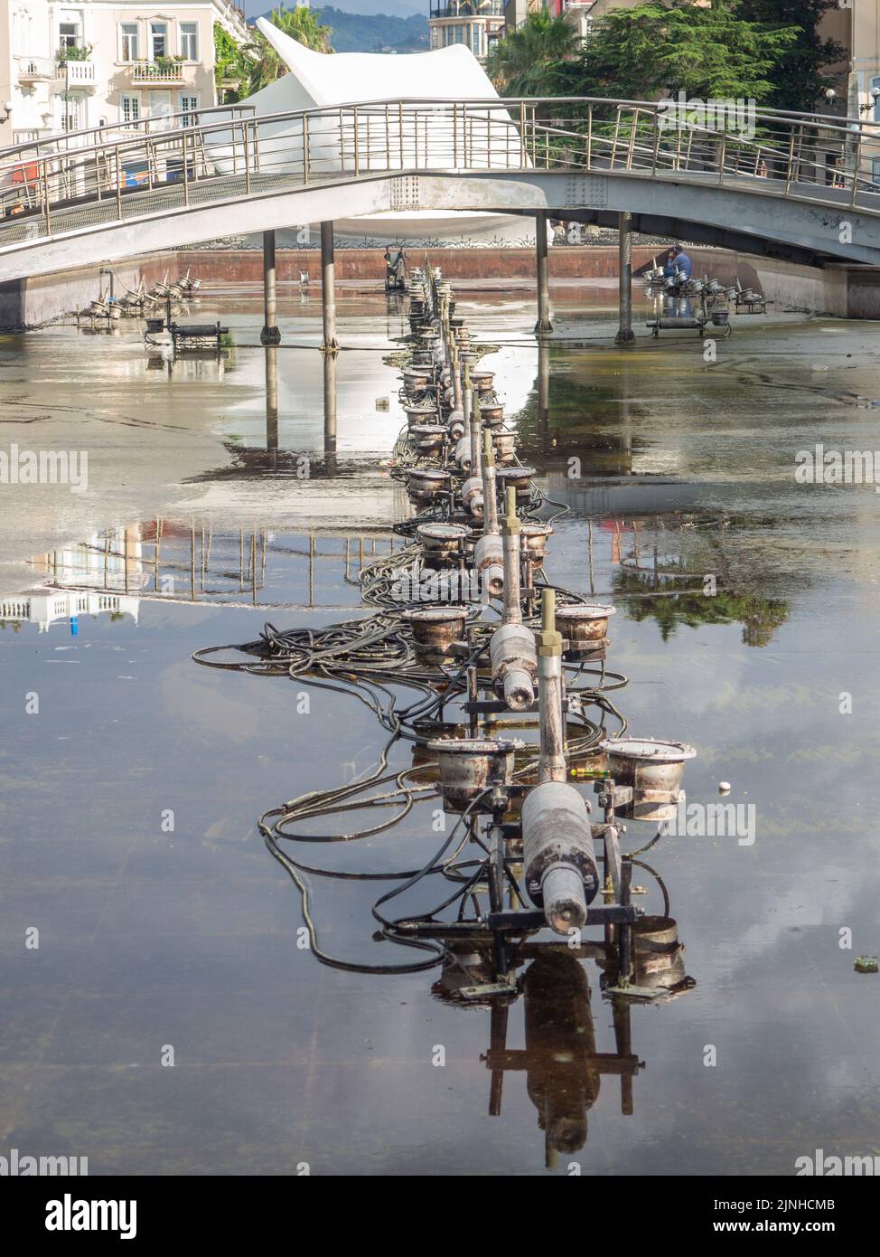 Equipment for dancing fountains. Drained fountain in the park. Without ...