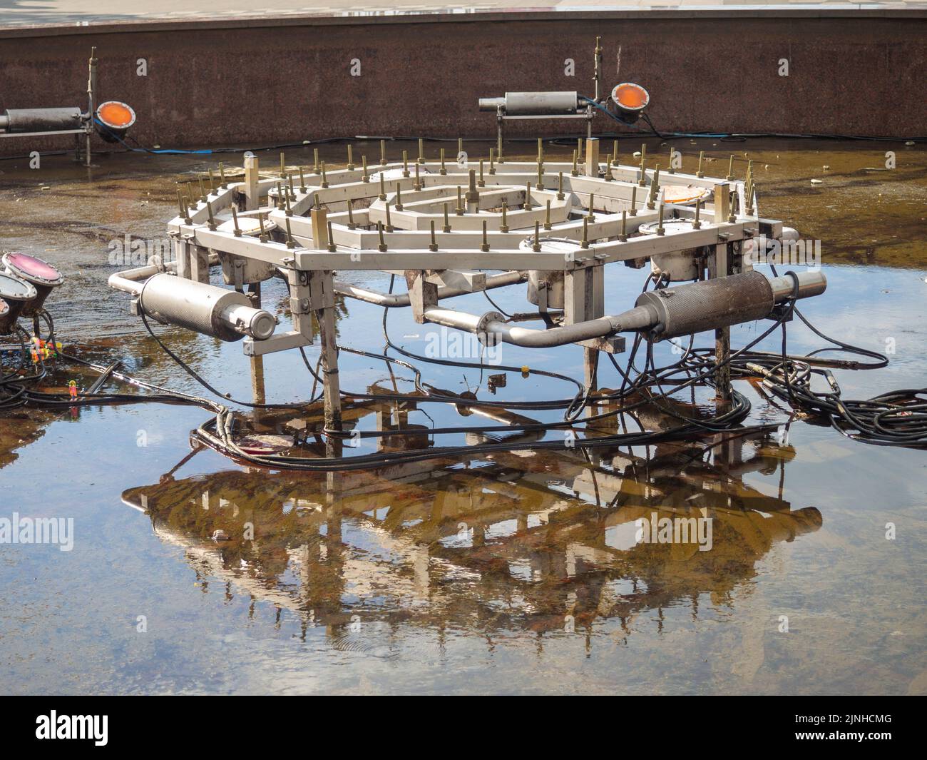 Equipment for dancing fountains. Drained fountain in the park. Without ...
