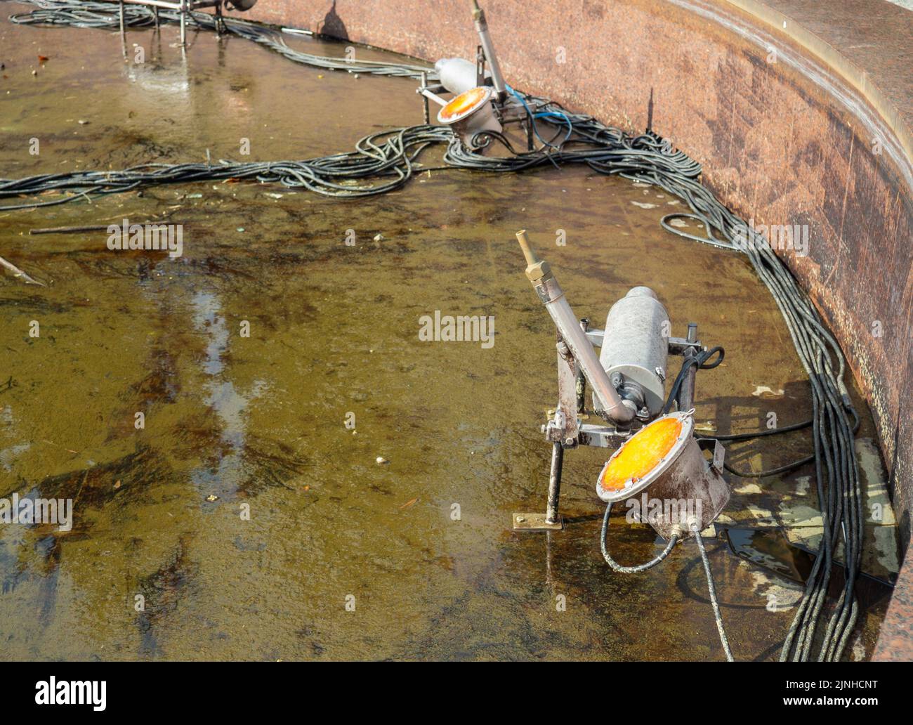 Equipment for dancing fountains. Drained fountain in the park. Without ...