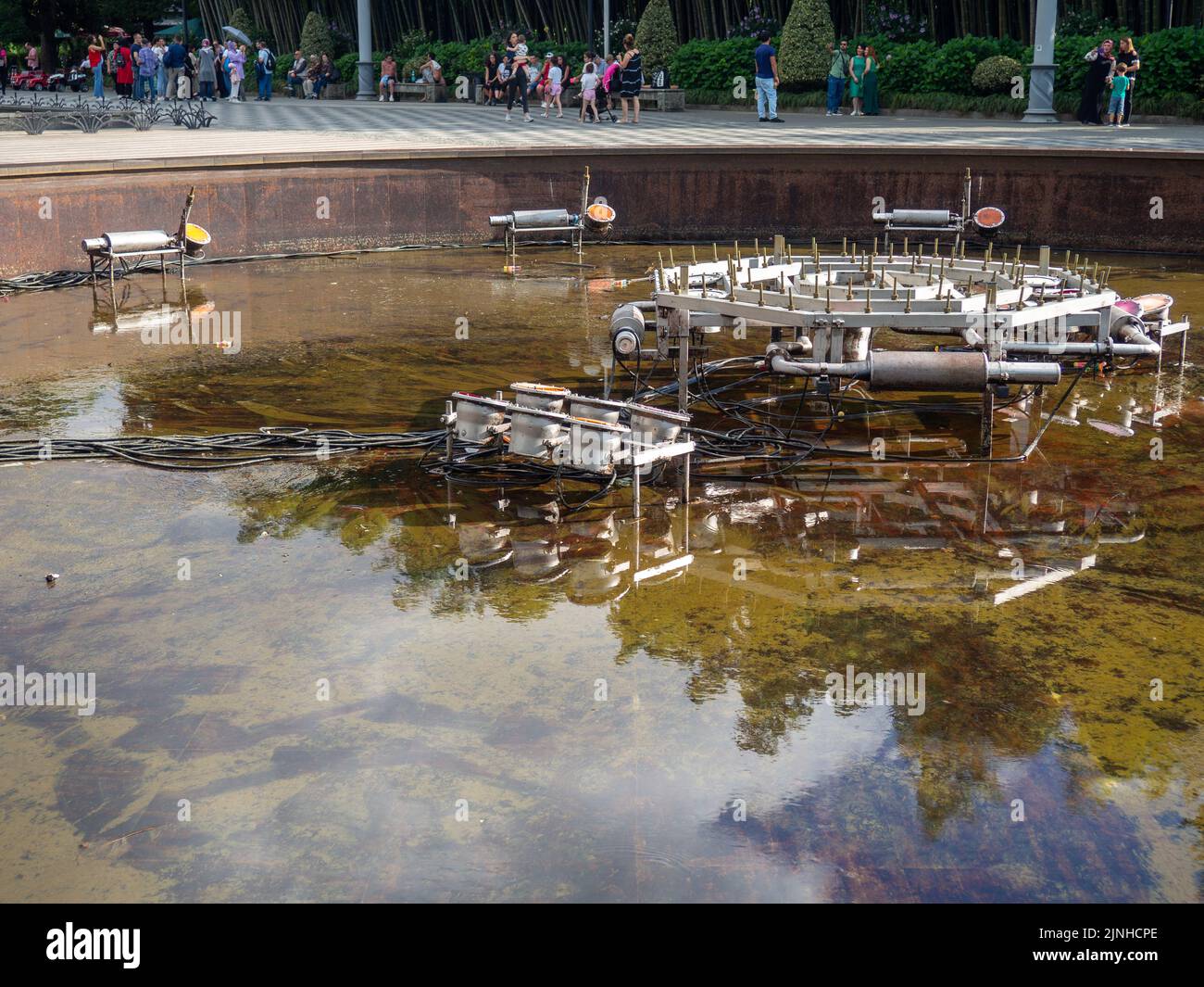 Equipment for dancing fountains. Drained fountain in the park. Without ...