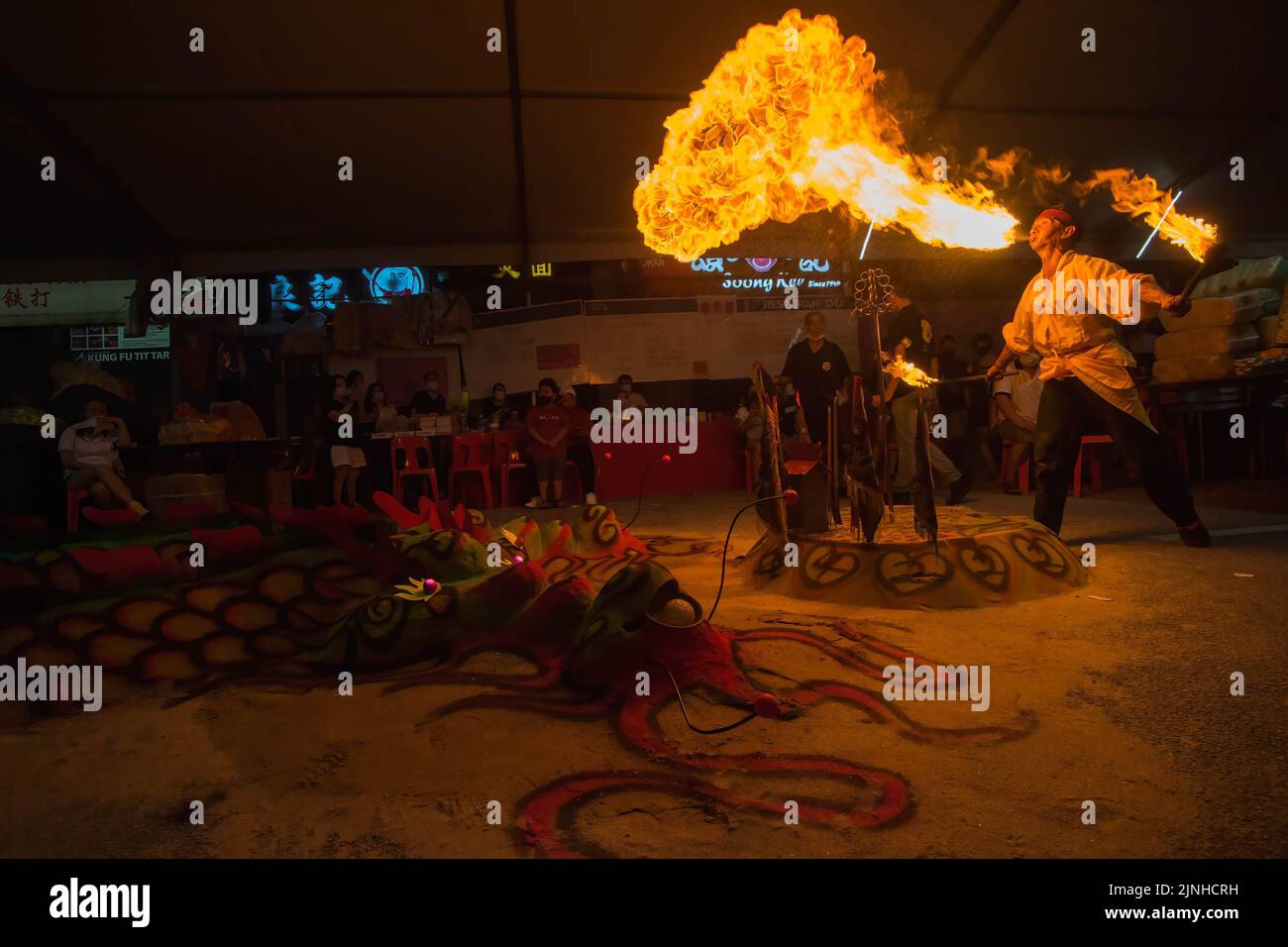 Ethnic Chinese priest performs prayer rituals “Breaking the Hell’s Gate ...