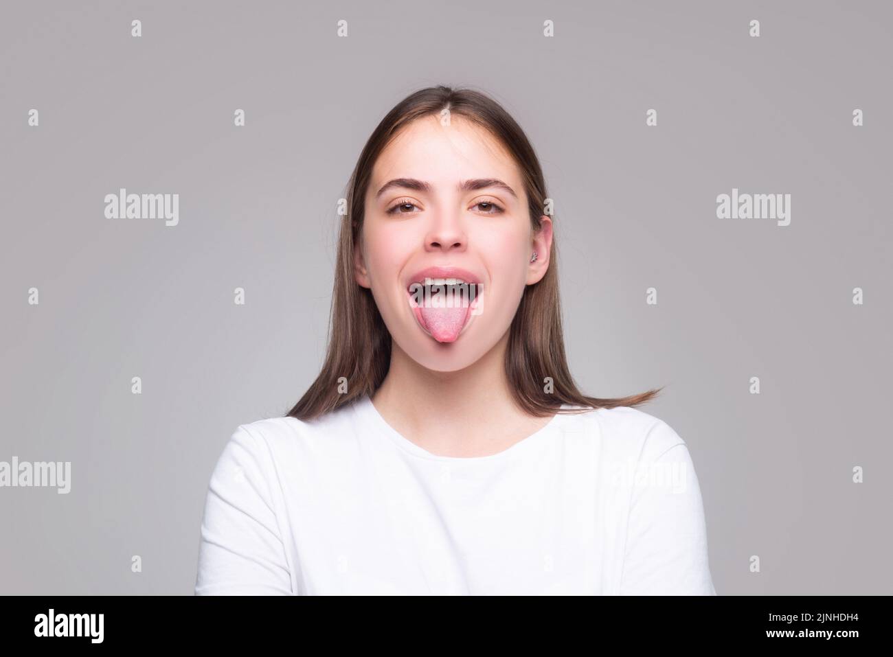 Beautiful Modern Model Shows Tongue Model With Sticking Tongue Out
