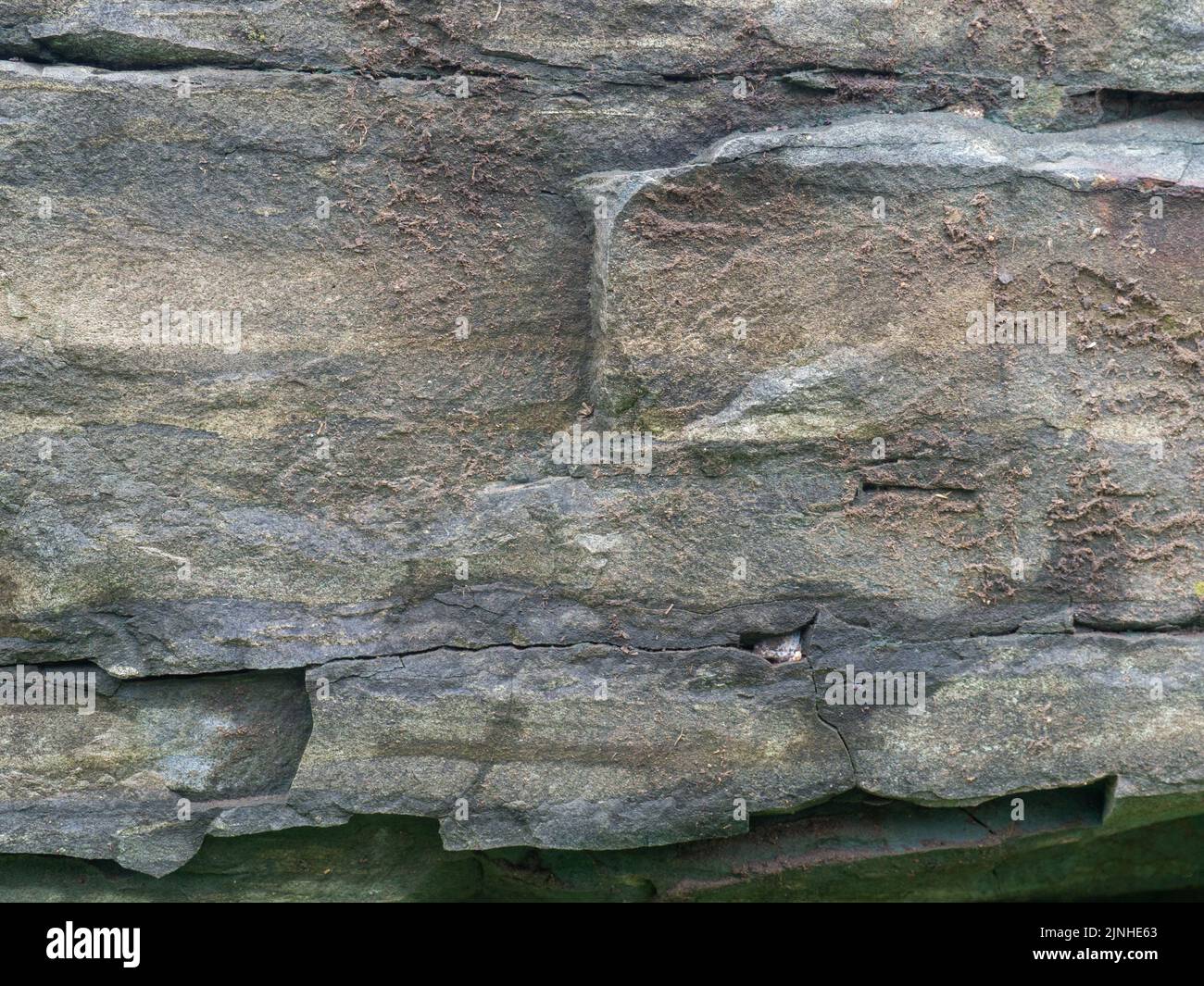The structure of the old stone masonry. Gray wall. Old cement joints ...
