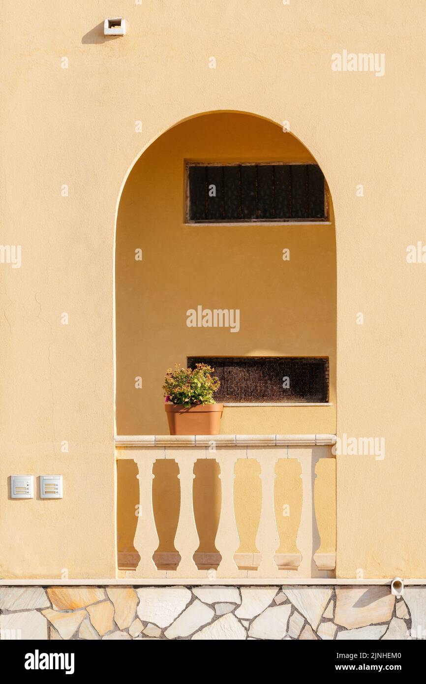 Typical yellow house facade part in italian city near the sea ...