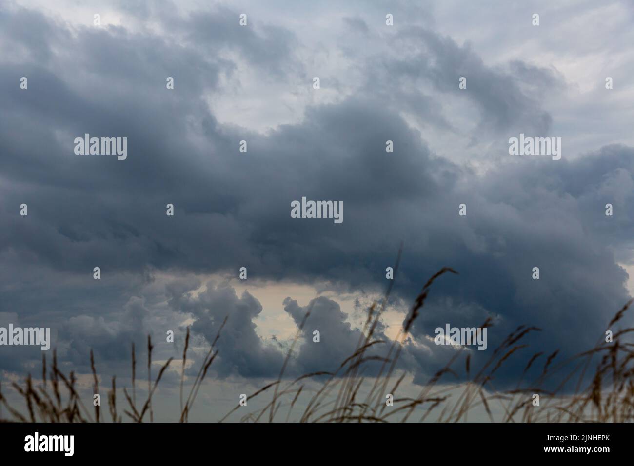 Dramatic dark cloudy sky over sea, natural photo background Stock Photo ...