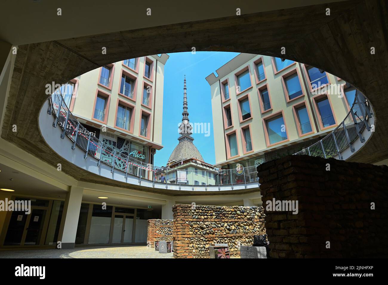 A circular opening of a building looking into the Mole Antonelliana ...