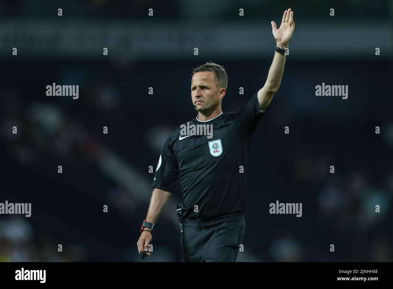 Referee David Webb points to give a corner kick Stock Photo - Alamy