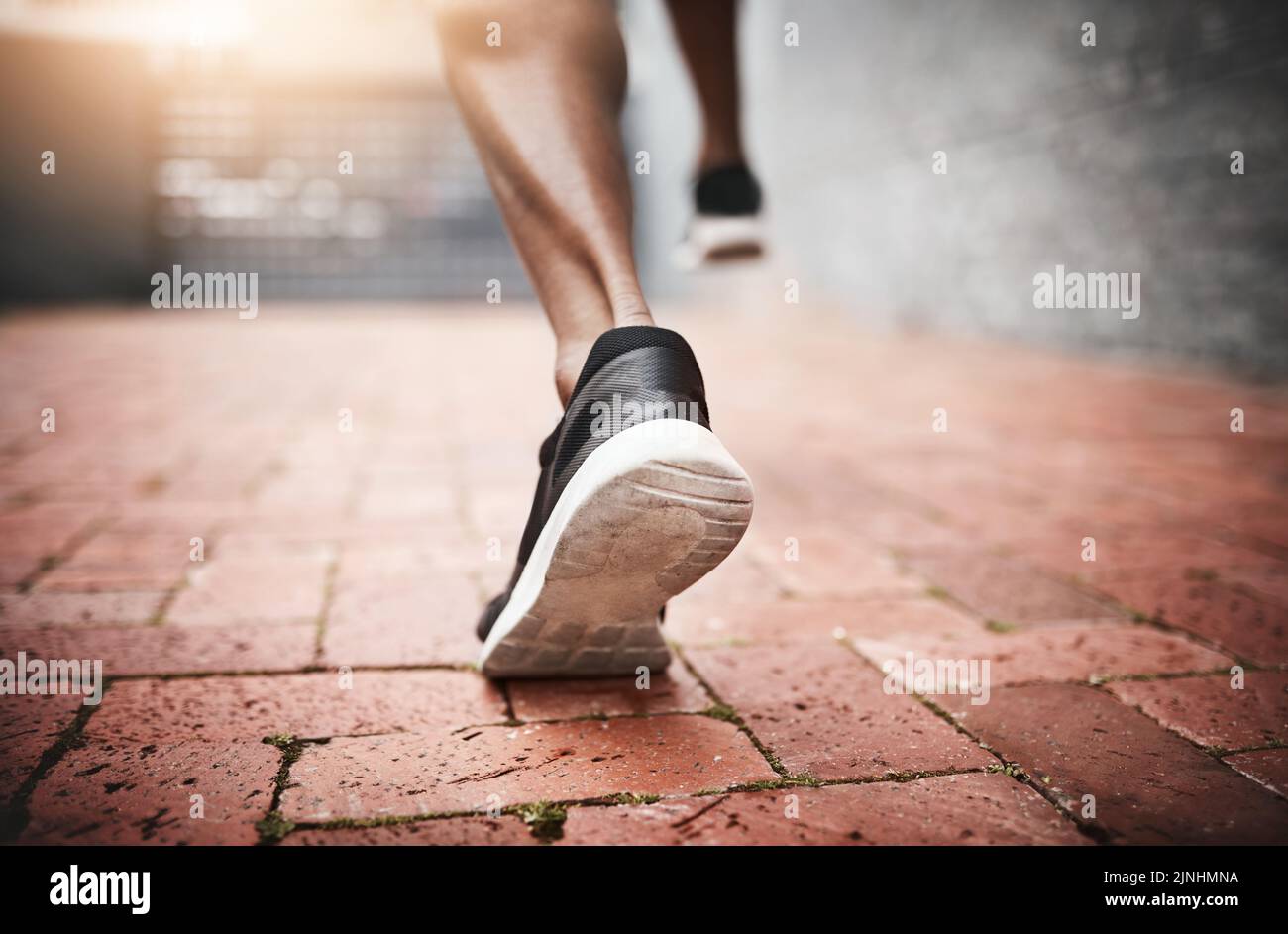 Run your heart out. Closeup shot of an unrecognizable man exercising ...