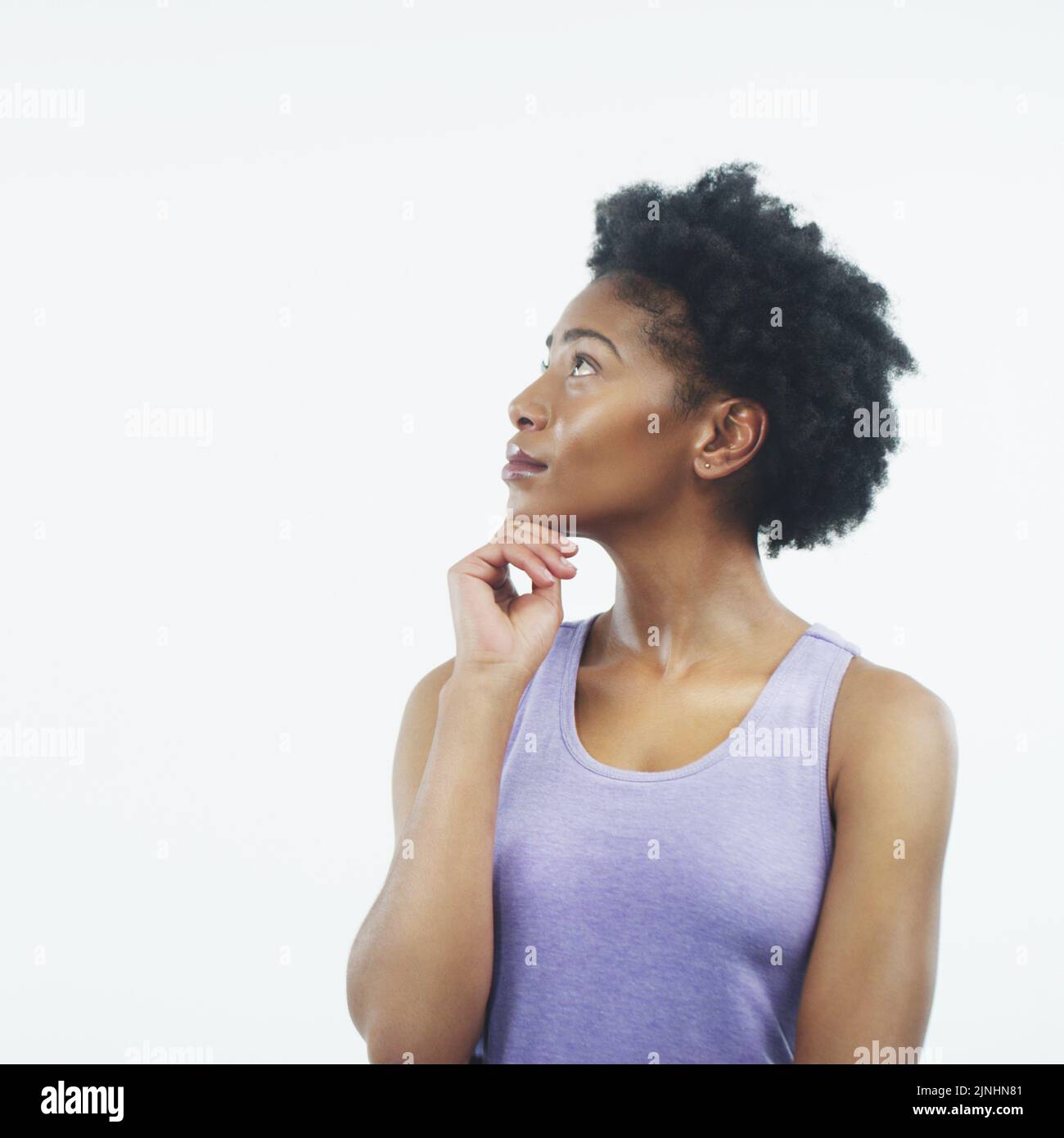 Thinking outside the box. Studio shot of an attractive young woman ...