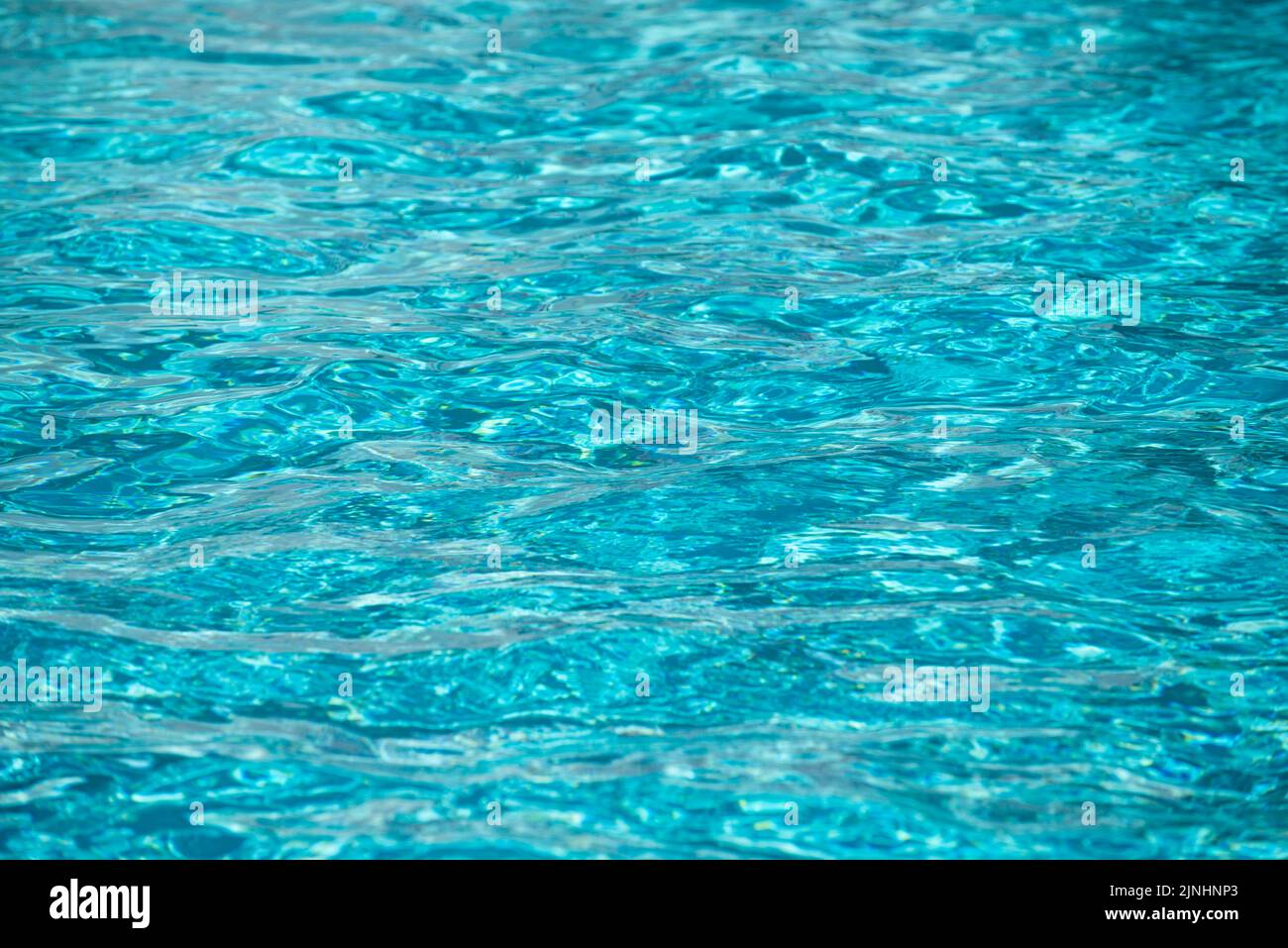 Water in swimming pool, background with high resolution. Wave abstract or rippled water texture ...