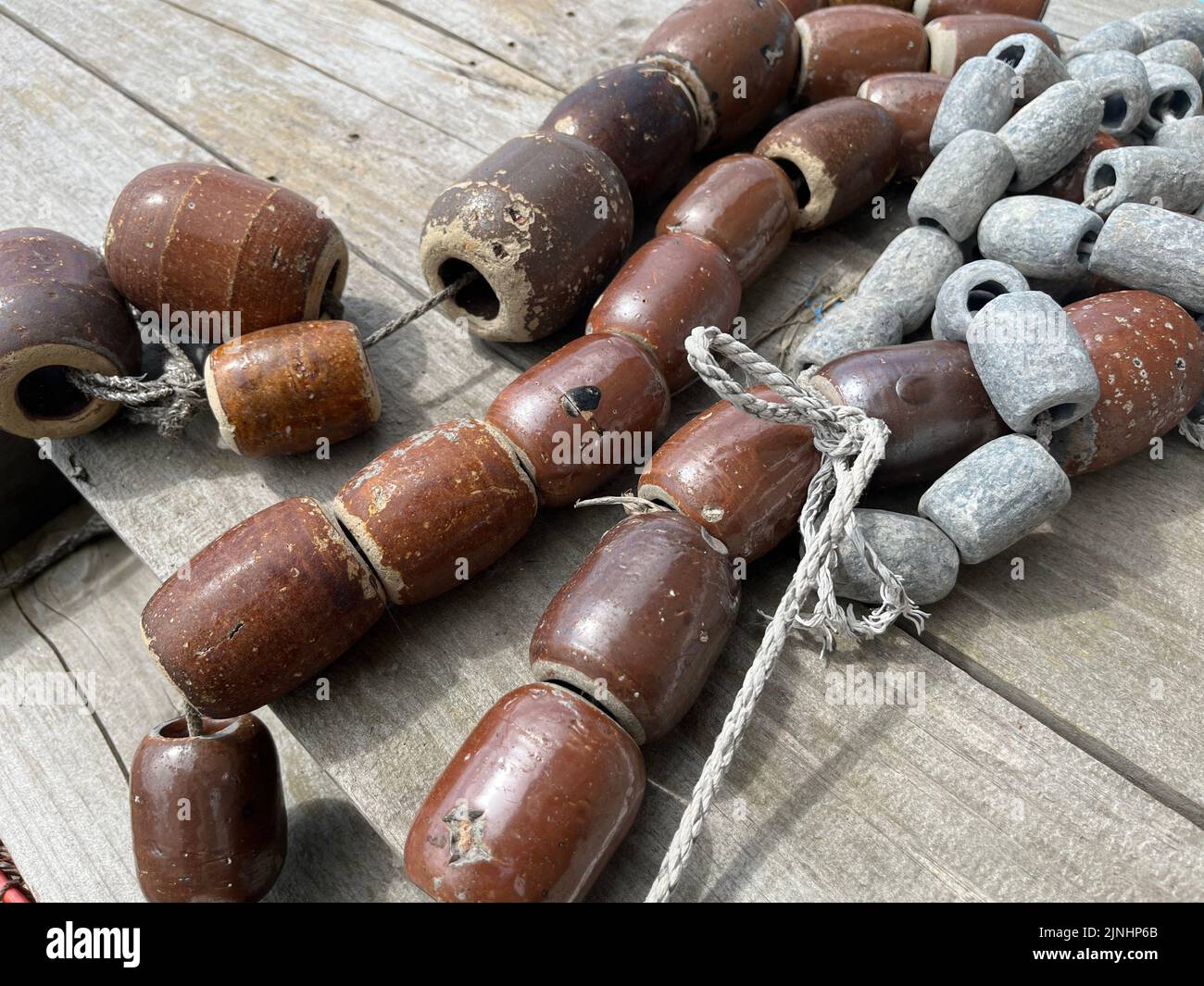 Strings of ceramic and lead fishing weights Stock Photo - Alamy
