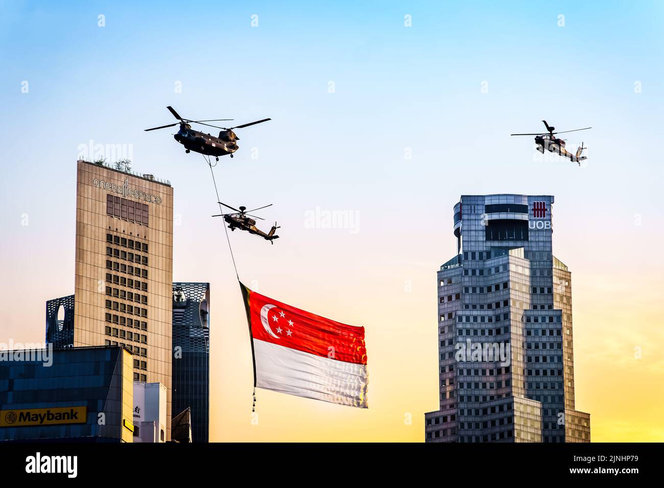 Chinook helicopter flying a giant Singapore national flag during ...
