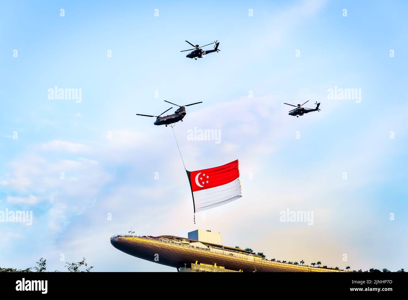Chinook helicopter flying a giant Singapore national flag during ...