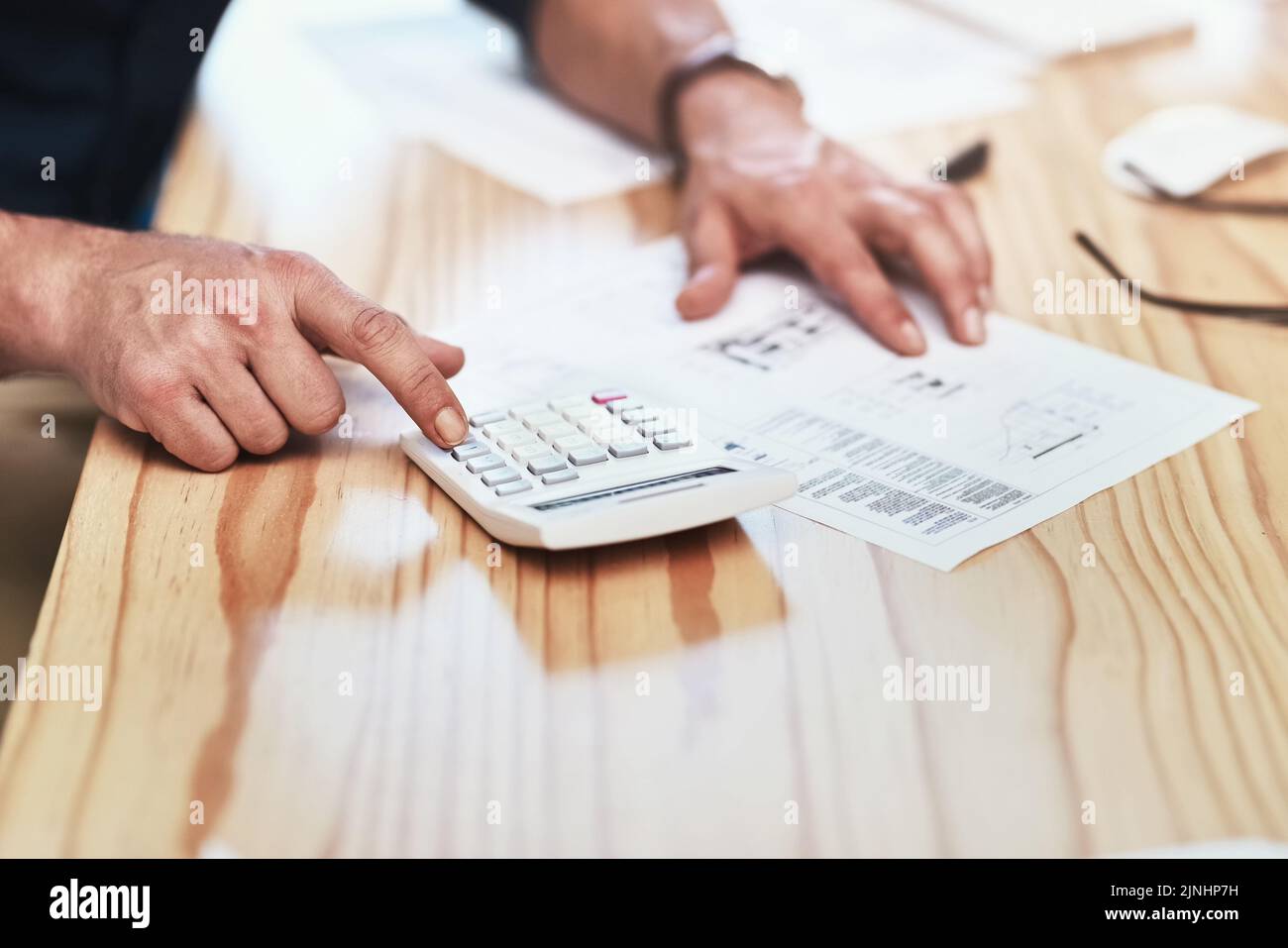 Contact me for a free quote. an unrecognizable man calculating ...
