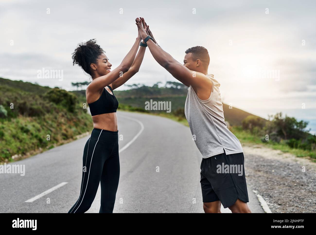 Were absolute winners today. a sporty young couple high fiving each ...