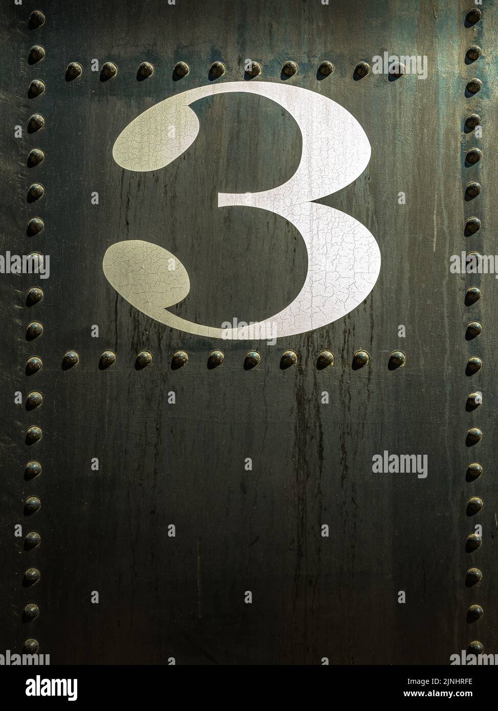 Numeral 3 on recognizable steam locomotive black steel siding Stock ...