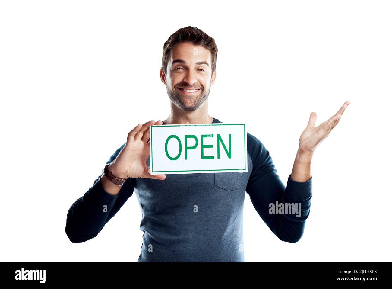 Youre officially invited to our opening. Studio portrait of a handsome ...