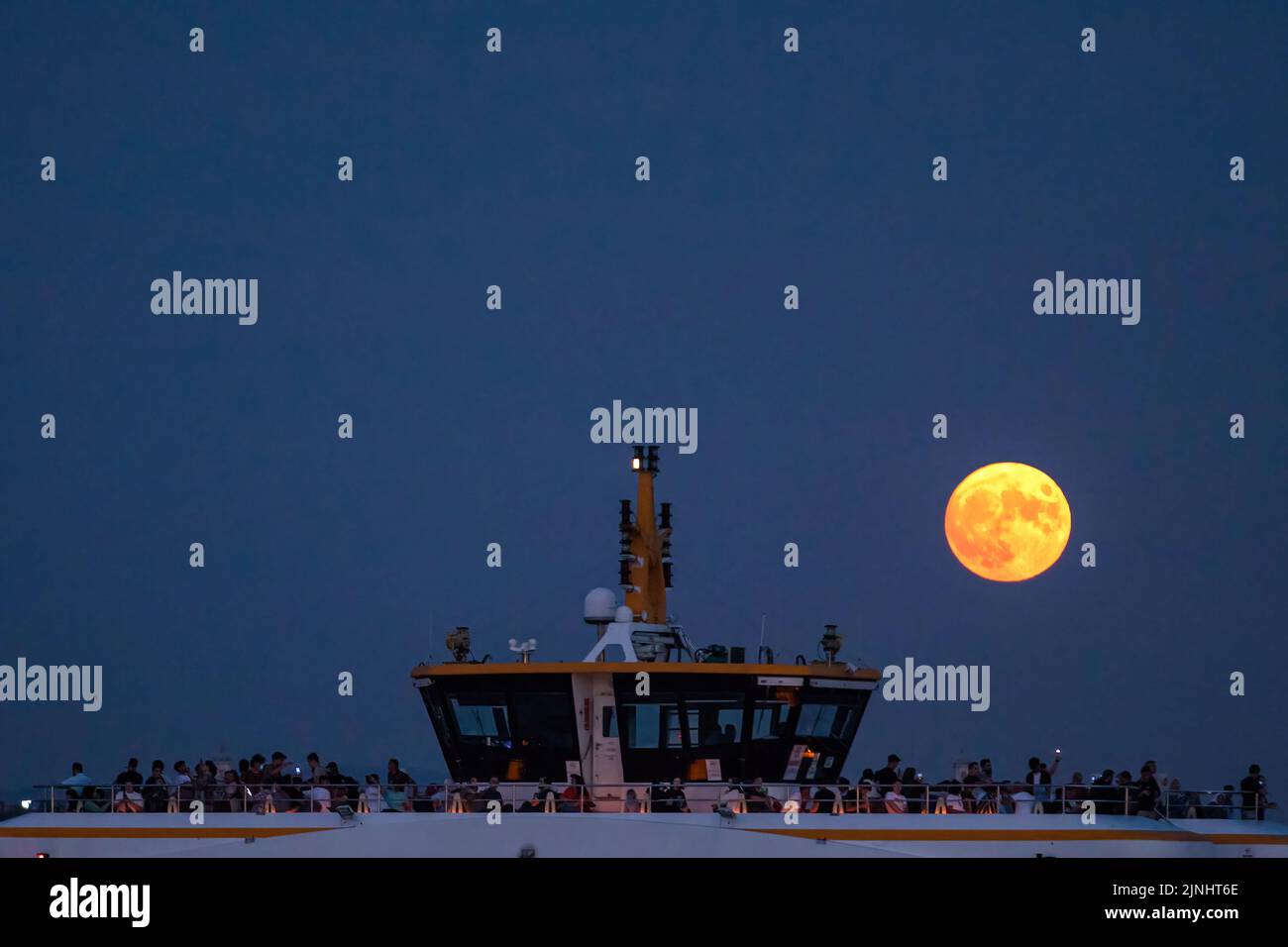 Istanbul, Turkey. 11th Aug, 2022. With the full moon in the sky ...