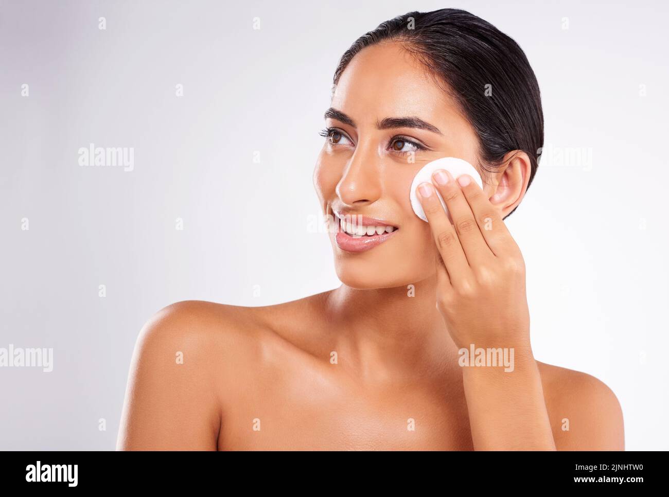 Her beauty is undeniable. Studio shot of a beautiful young woman ...