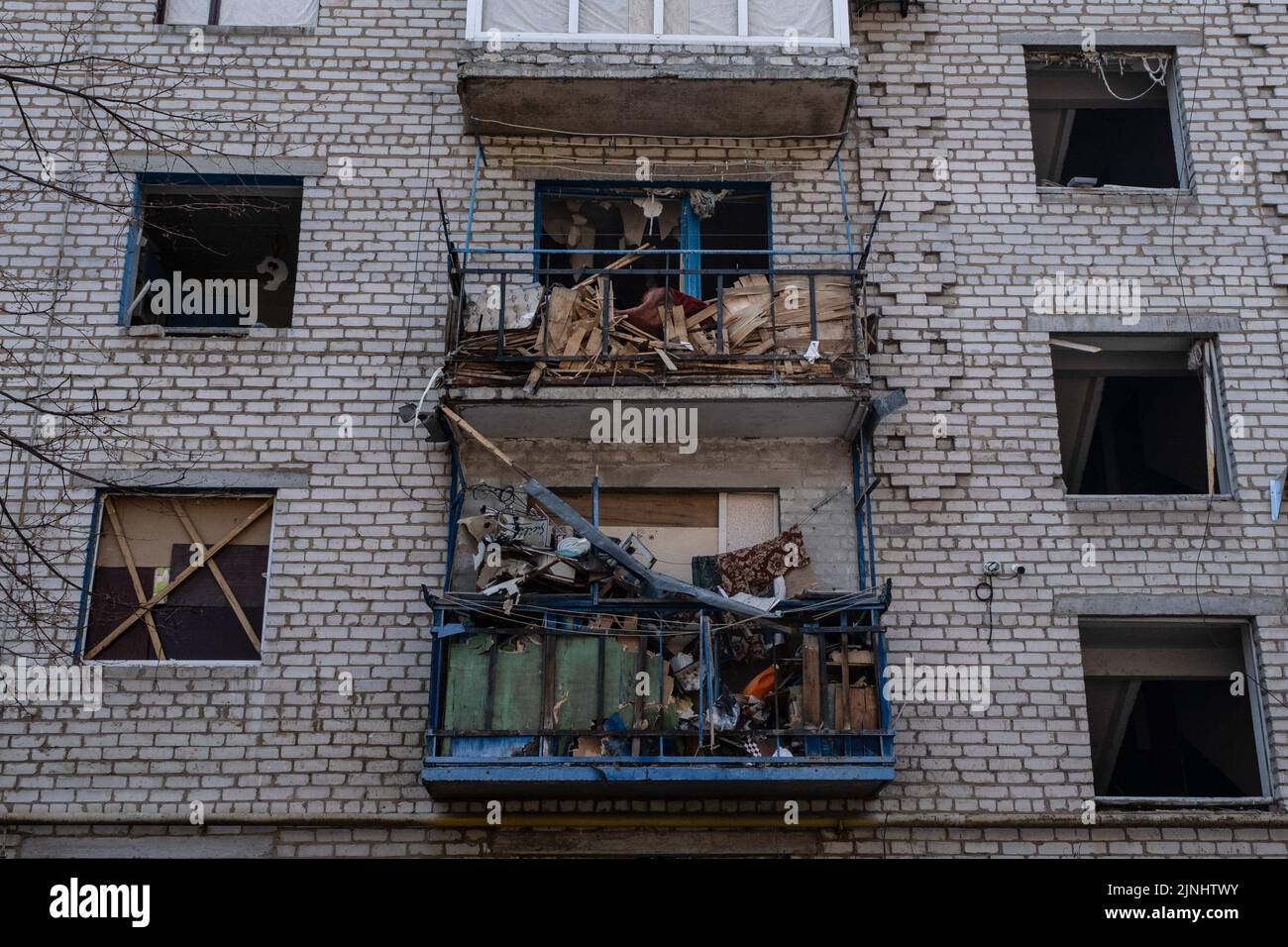 A destroyed balcony of a residential building by Russian missile strike ...