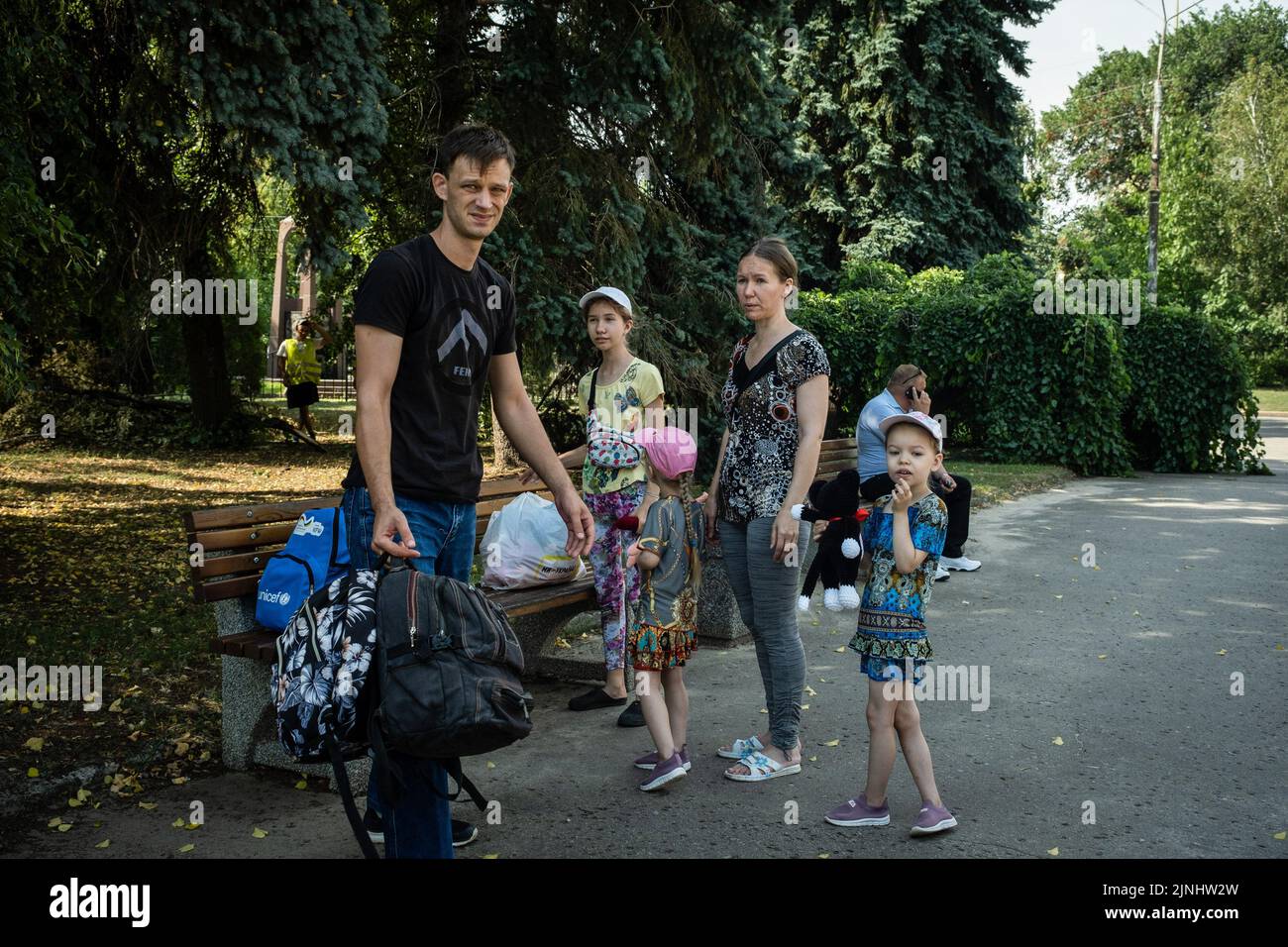 A family prepares to board an evacuation bus to Dnipro, in Slovyansk ...