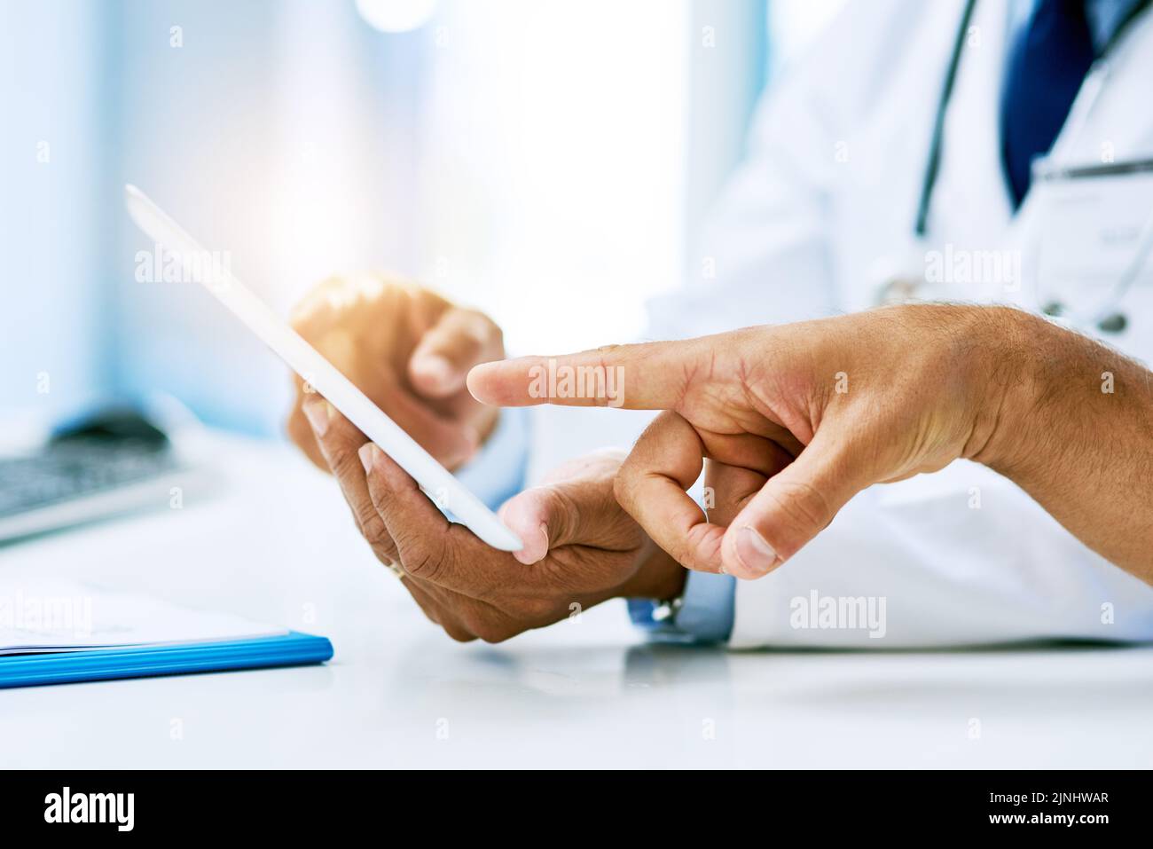 Have a look at this. an unrecognizable doctor and patient looking at ...