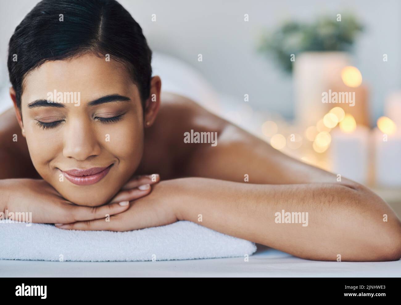 Woman thinking smile massage hi-res stock photography and images - Alamy