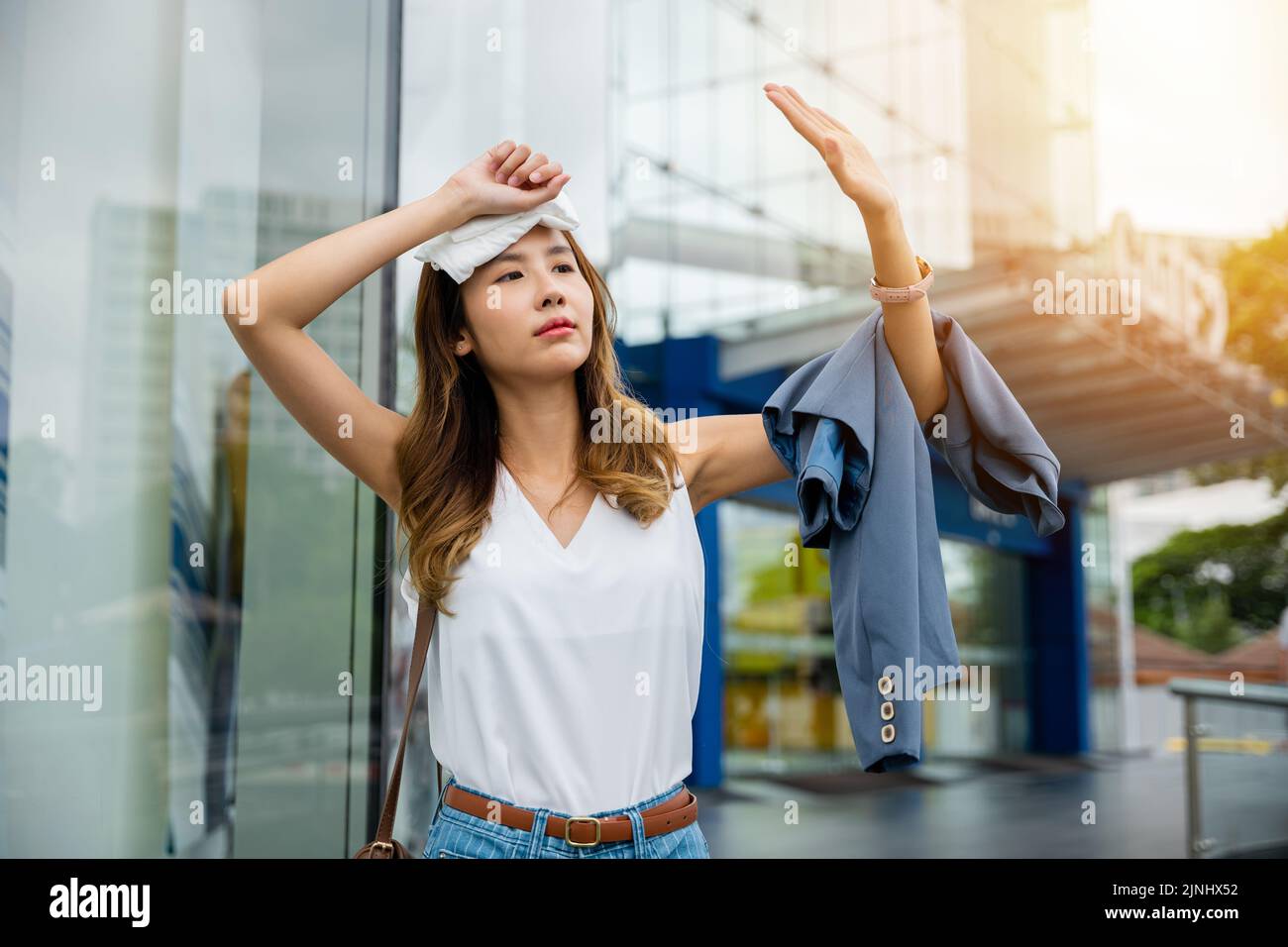 Angry female having sunstroke skin damage from sun UV city air ...