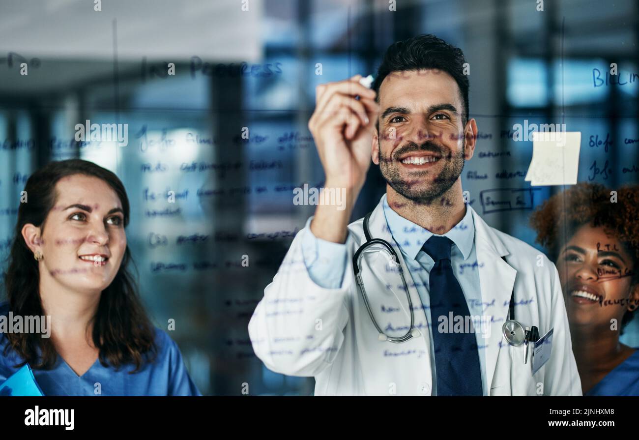 Mapping out the path to medical success. a team of doctors having a ...