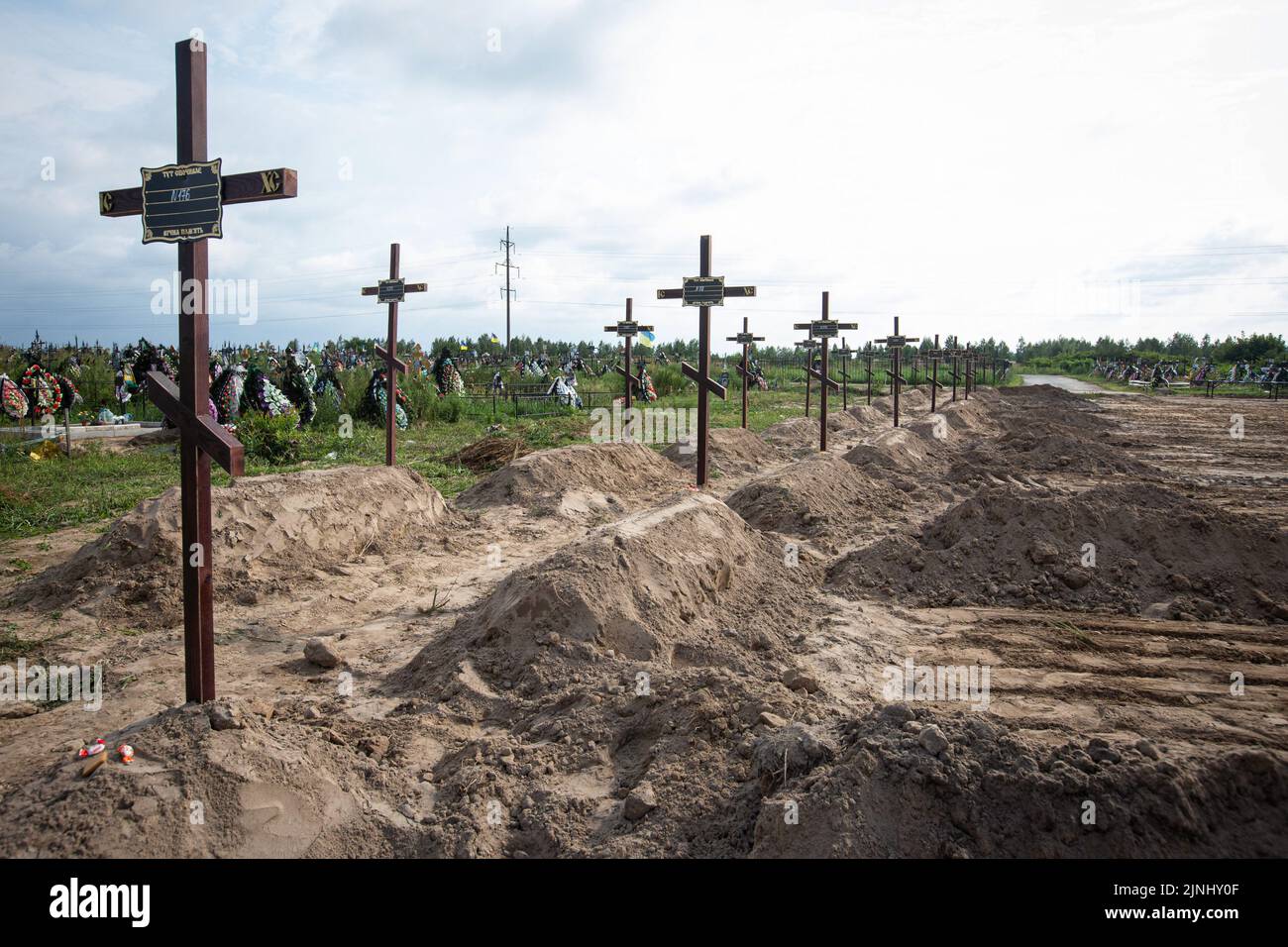 Bucha, Ukraine. 11th Aug, 2022. Crosses with numbers on the graves of ...