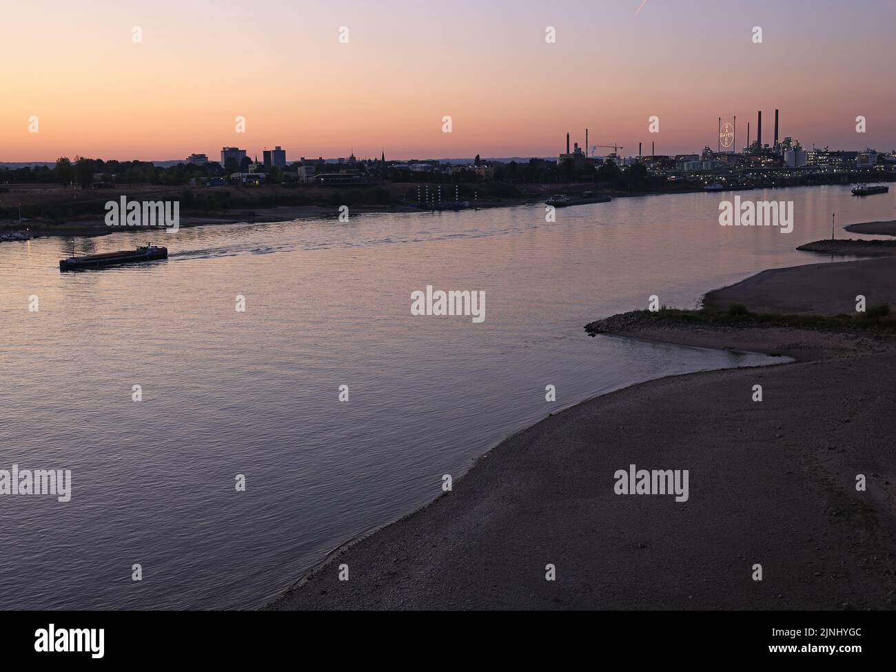 Cologne, Germany. 12th Aug, 2022. A ship sails across the Rhine at a ...