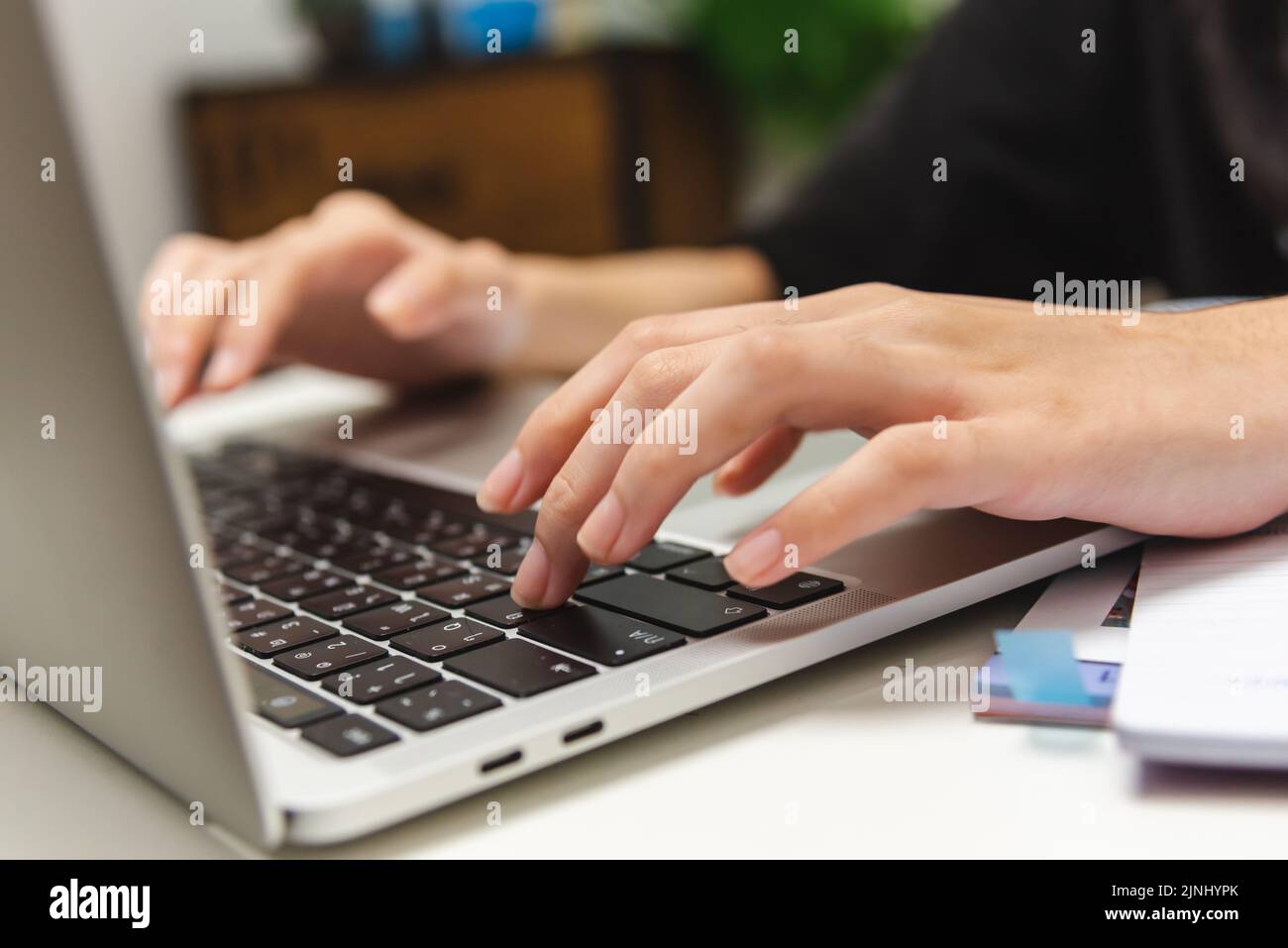 Woman hand using keyboard computer laptop internet communication social ...