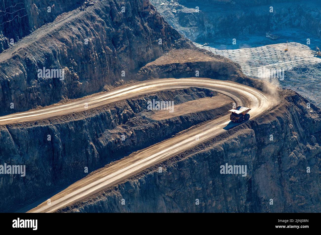Ore trucks on the road into the Kalgoorlie super-pit gold mine in West ...