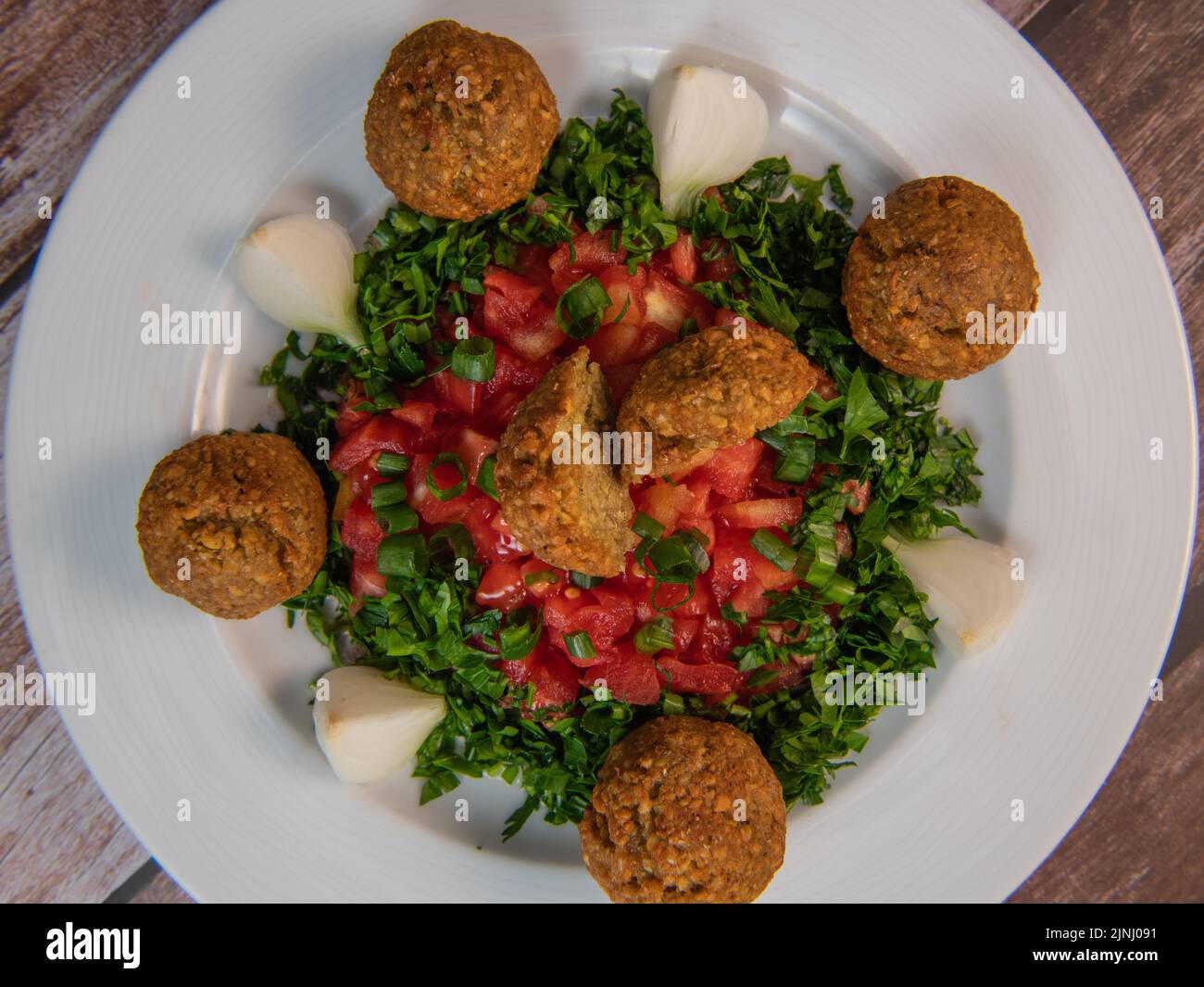 Vegetarian dish, falafel balls from spiced chickpeas with chopped ...