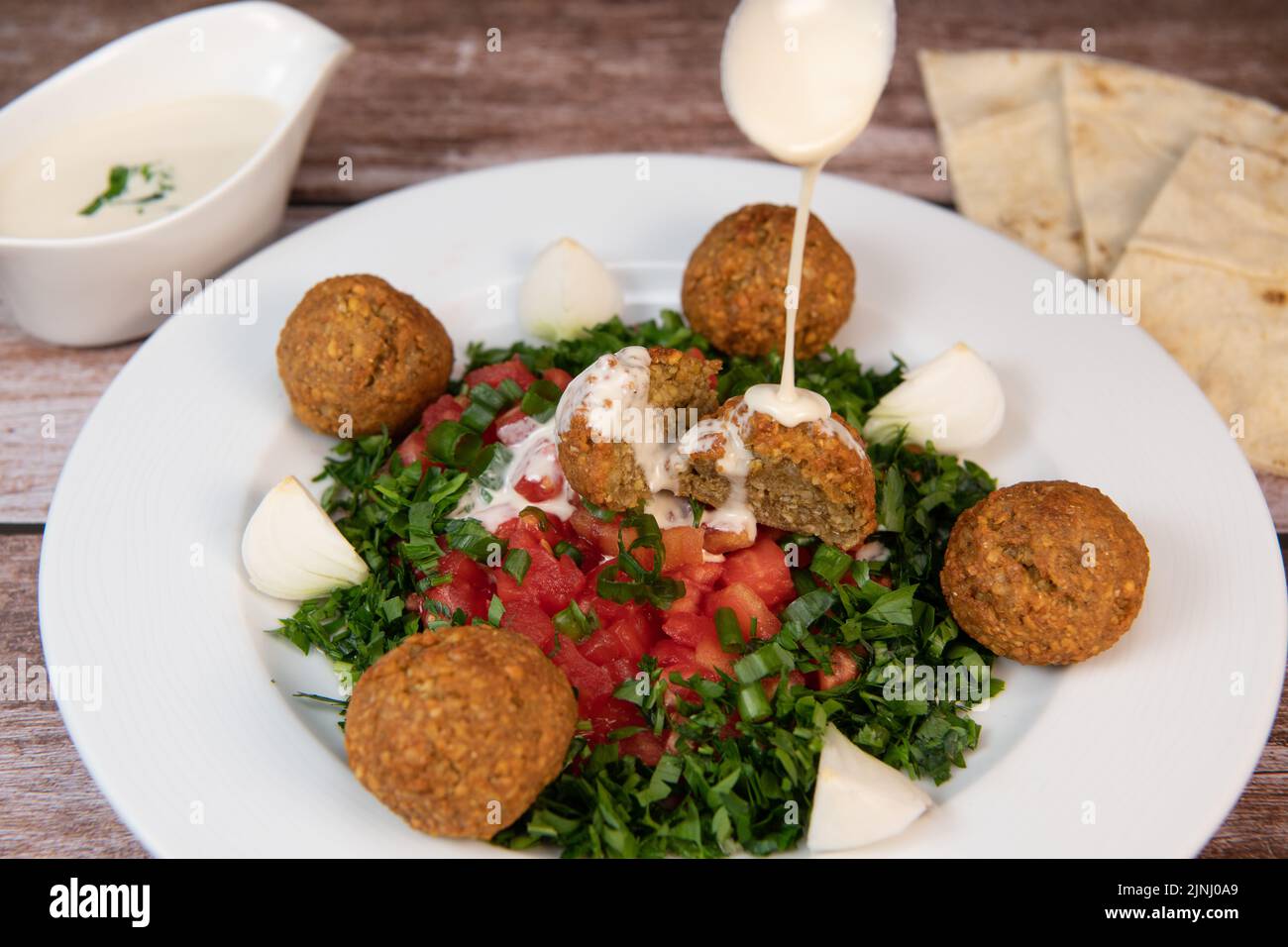 Vegetarian dish, falafel balls from spiced chickpeas with chopped ...