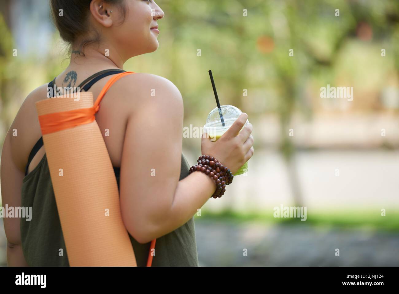 Smiling obese woman looking away and enjoying picturesque view at ... Smiling obese woman looking away and enjoying picturesque view at ...