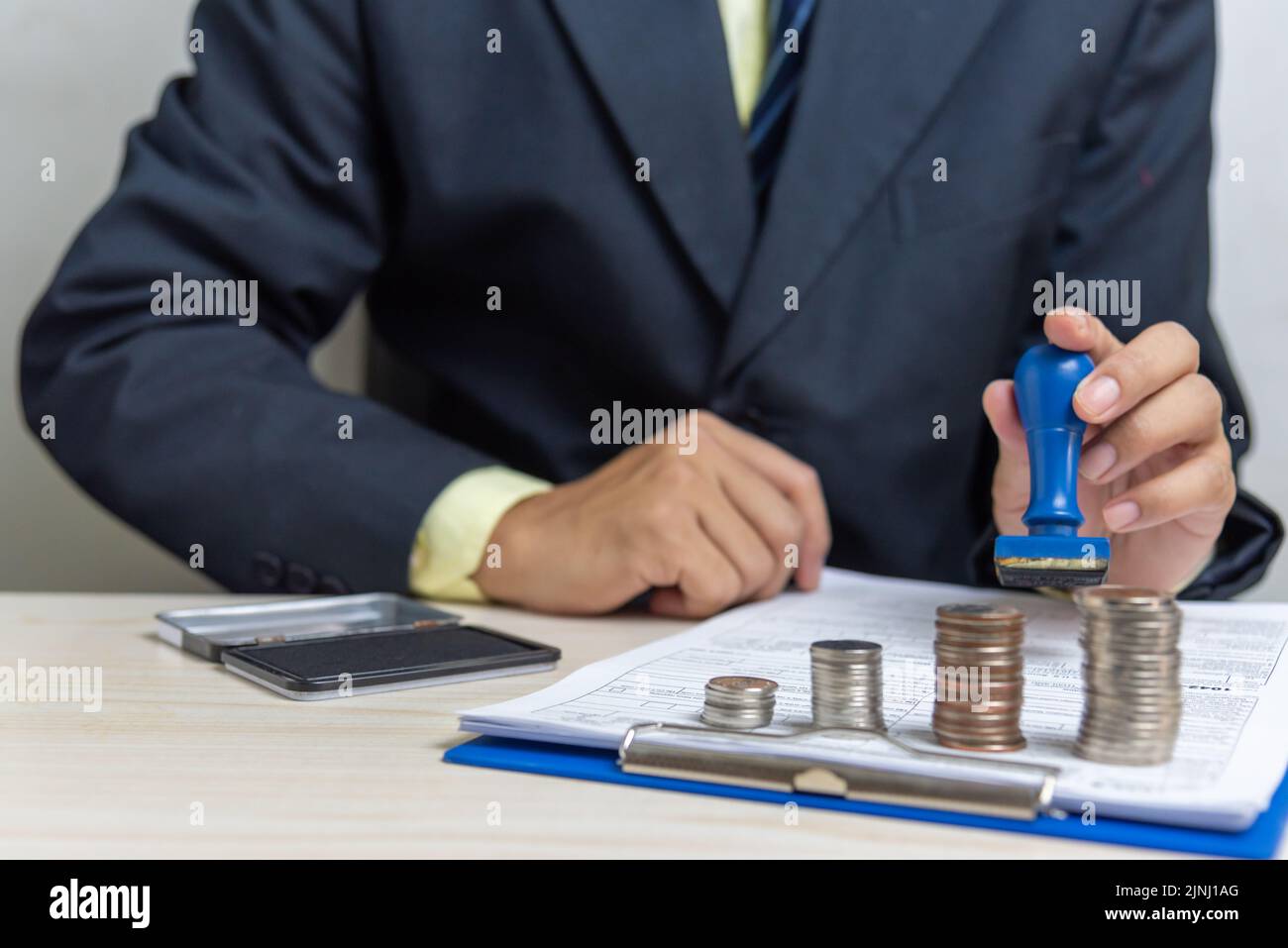Holding rubber stamp hi-res stock photography and images - Alamy