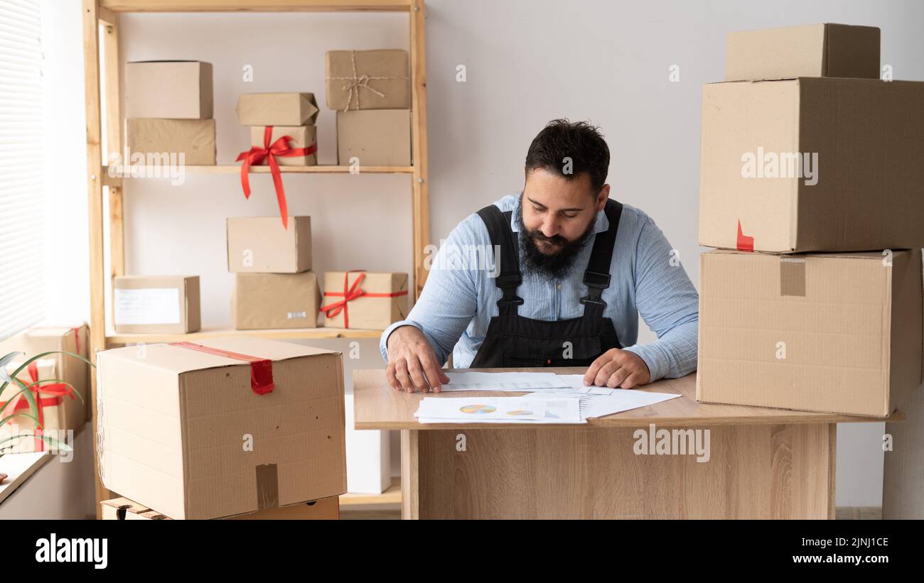Start up. young indian man take new order from customer with clip board ...