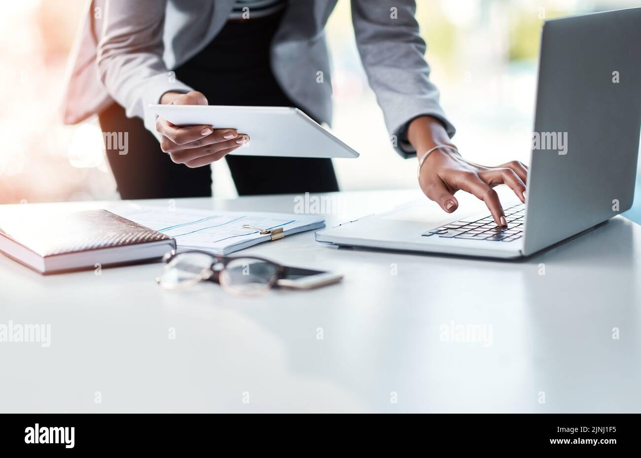 Reading, sending or checking an email or report while at work in at a ...