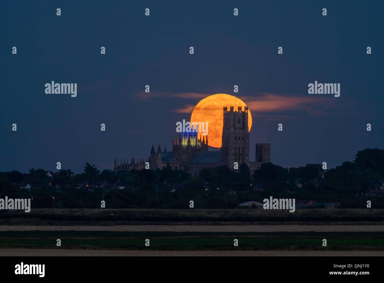 The full moon rises behind Ely Cathedral in Cambridgeshire, UK Stock ...