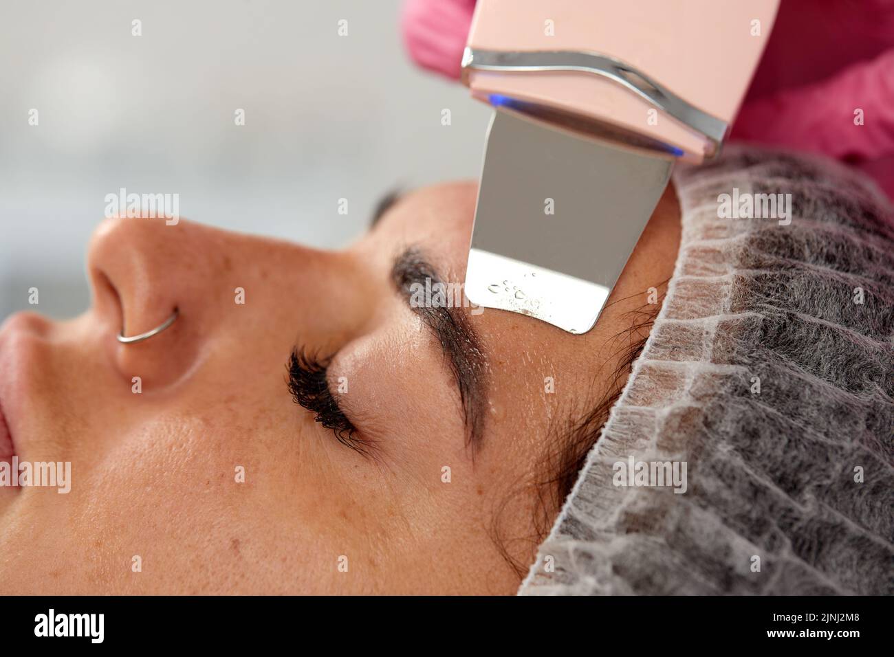 Skin Care. Close-up Of Beautiful Woman Receiving Ultrasound Cavitation ...