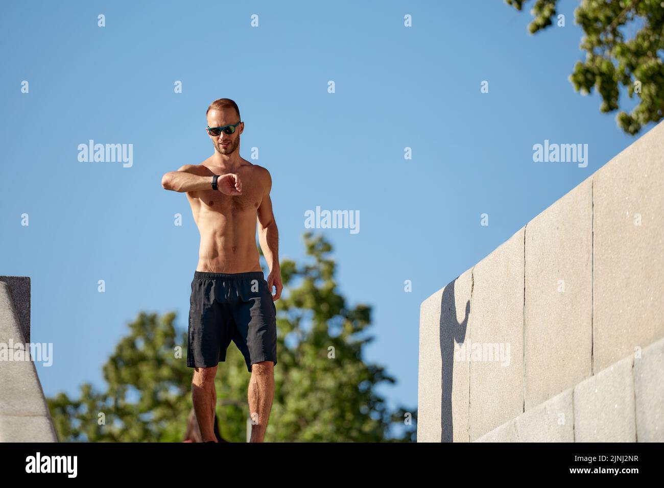 Young athlete man do morning run. Male runs up the stairs doing cardio ...