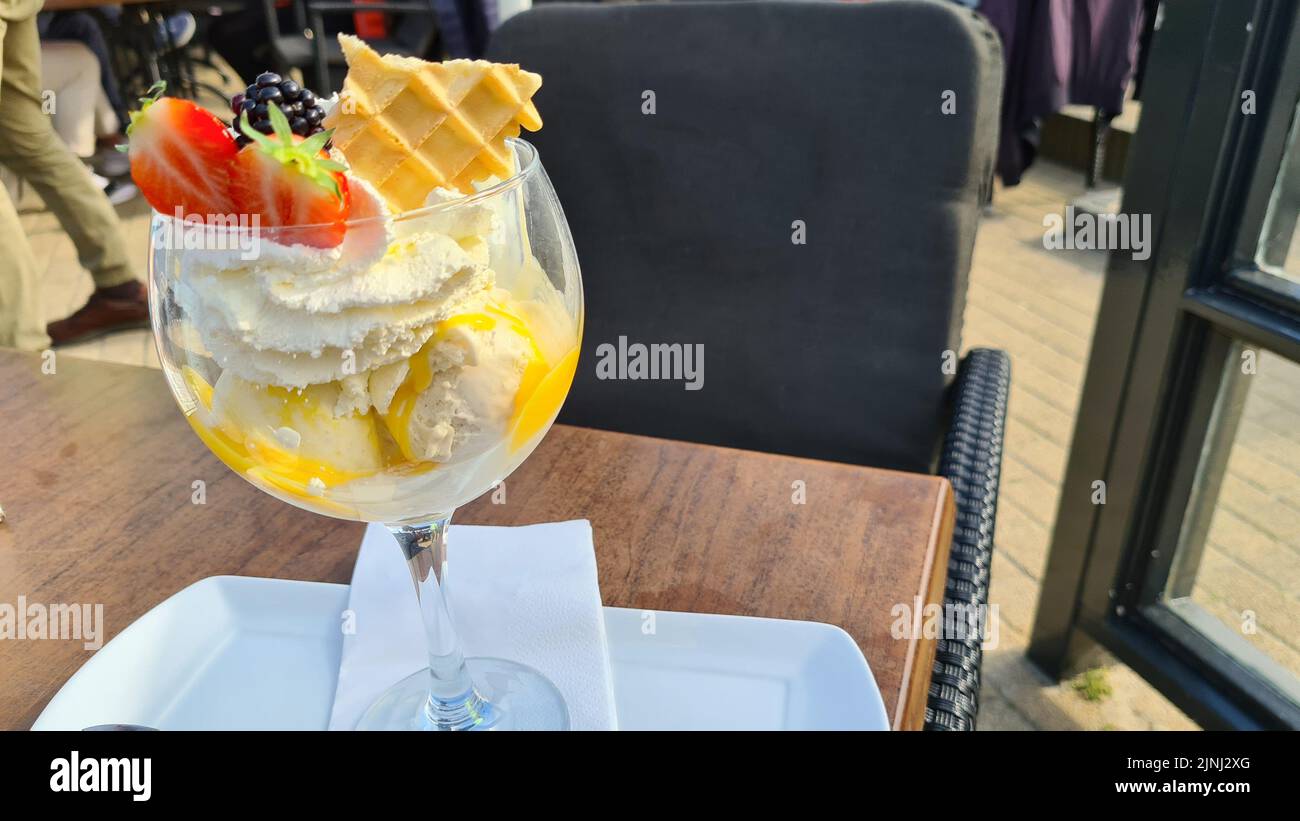 Hot & cold - berry ice cream specialty with ice cream & pudding Stock ...