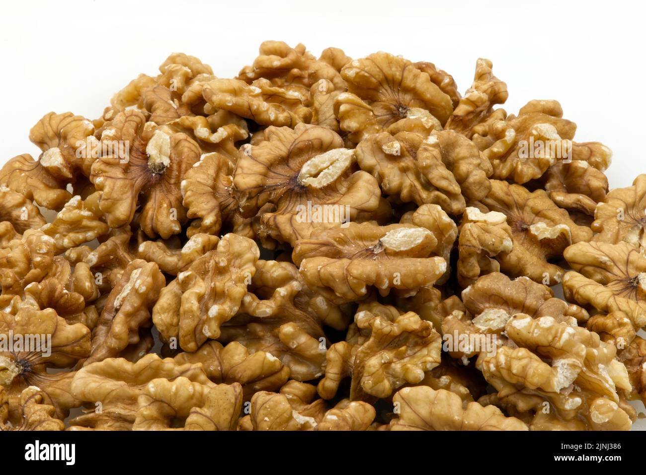 Pile of walnuts isolated on white background. Food texture concept ...