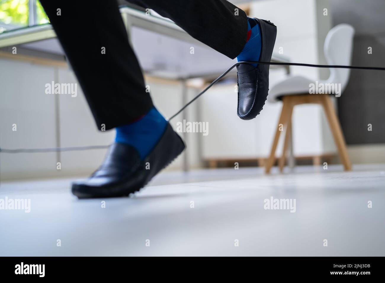 Wire Cord Trip Over And Fall. Feet Stumble On Cable Stock Photo - Alamy